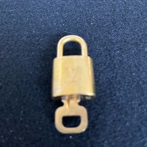 Louis Vuitton | Other | Authentic Lv Lock And Key Bag Charm | Poshmark